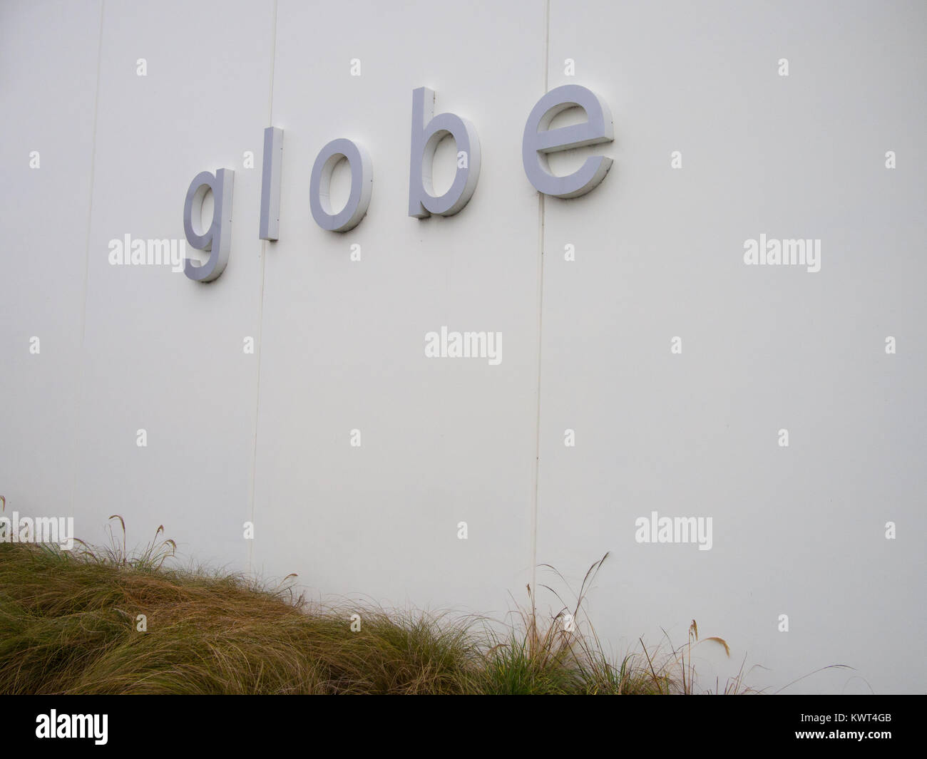 Globe Sign On A Wall Stock Photo - Alamy