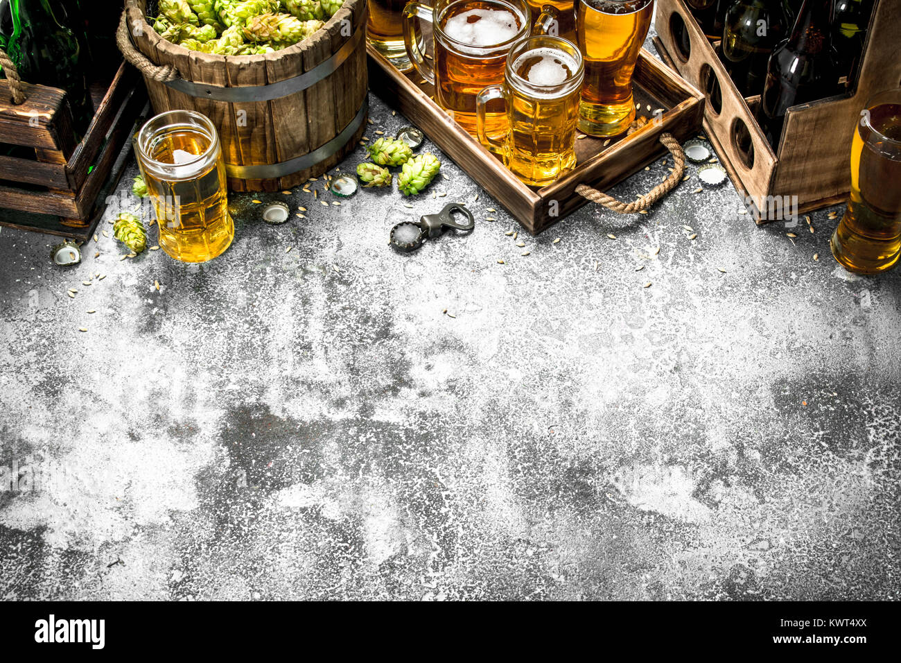 Beer background. Fresh beer with ingredients. On a rustic background ...