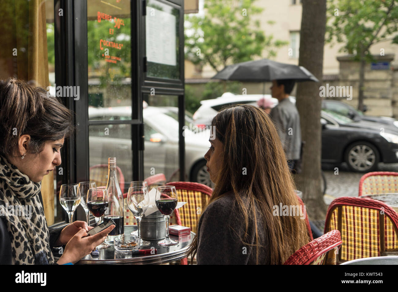 France, Paris, Young women in cafe on a rainy day Stock Photo - Alamy