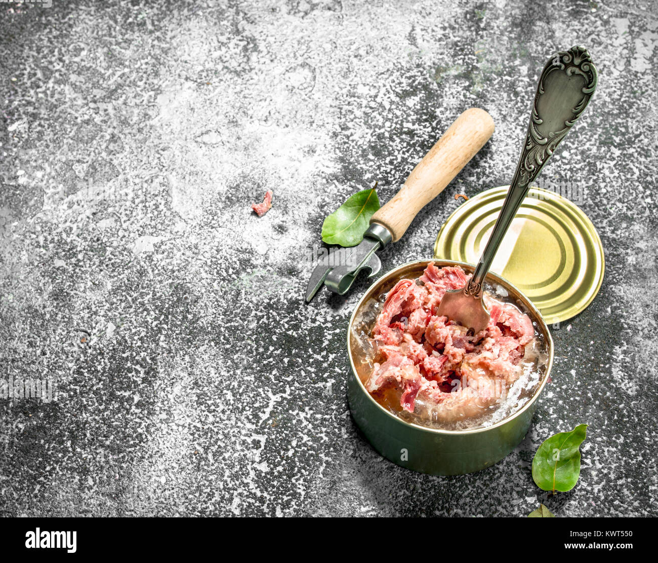 Canned meat in a tin can. On a rustic background Stock Photo - Alamy