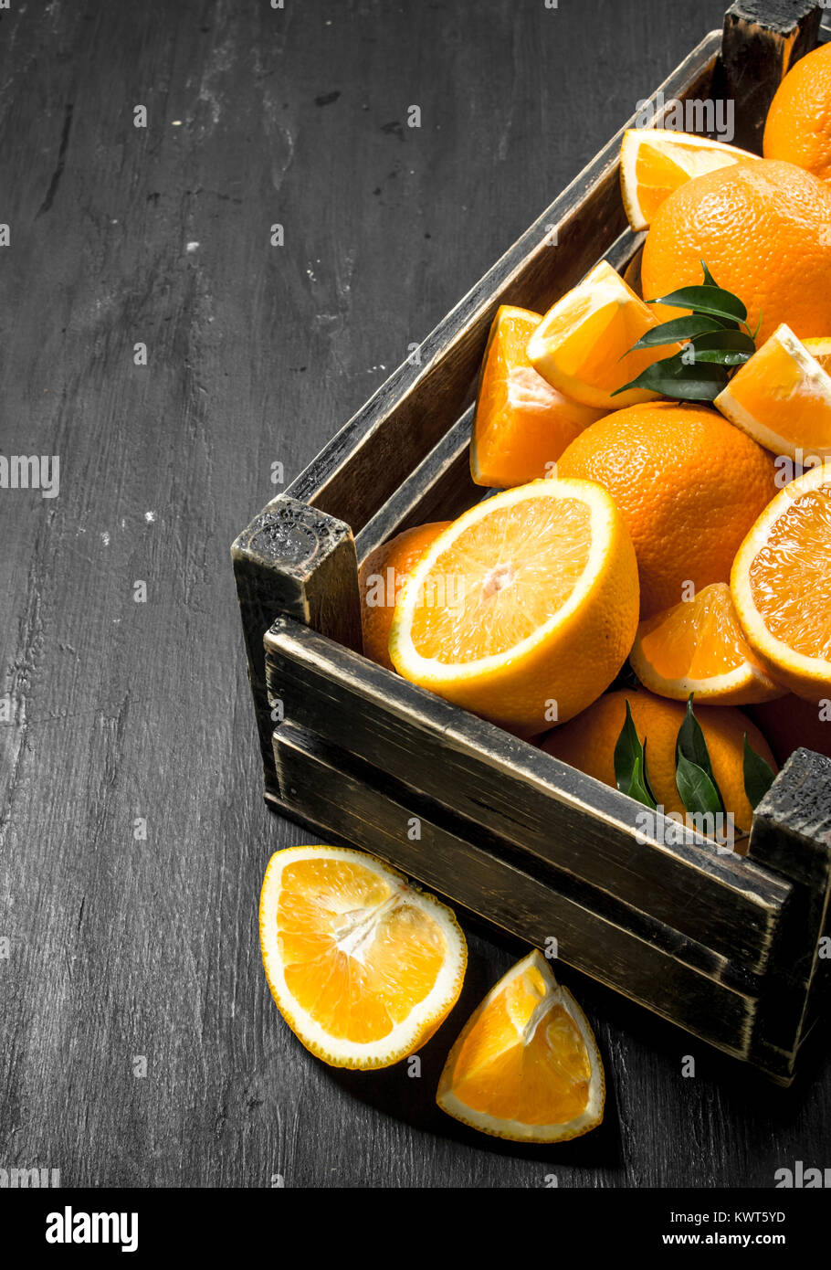 Fresh oranges in an old box. On the black chalkboard Stock Photo - Alamy