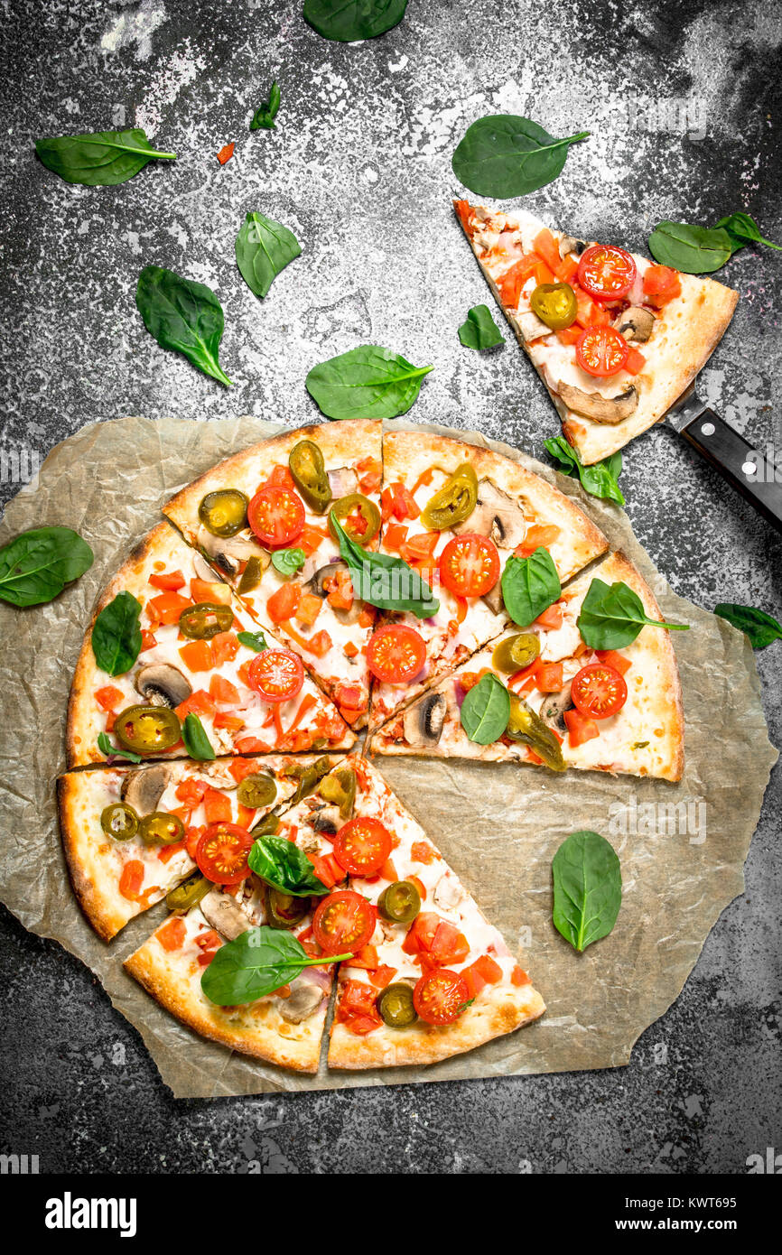 Mexican pizza with herbs. On a rustic background Stock Photo - Alamy