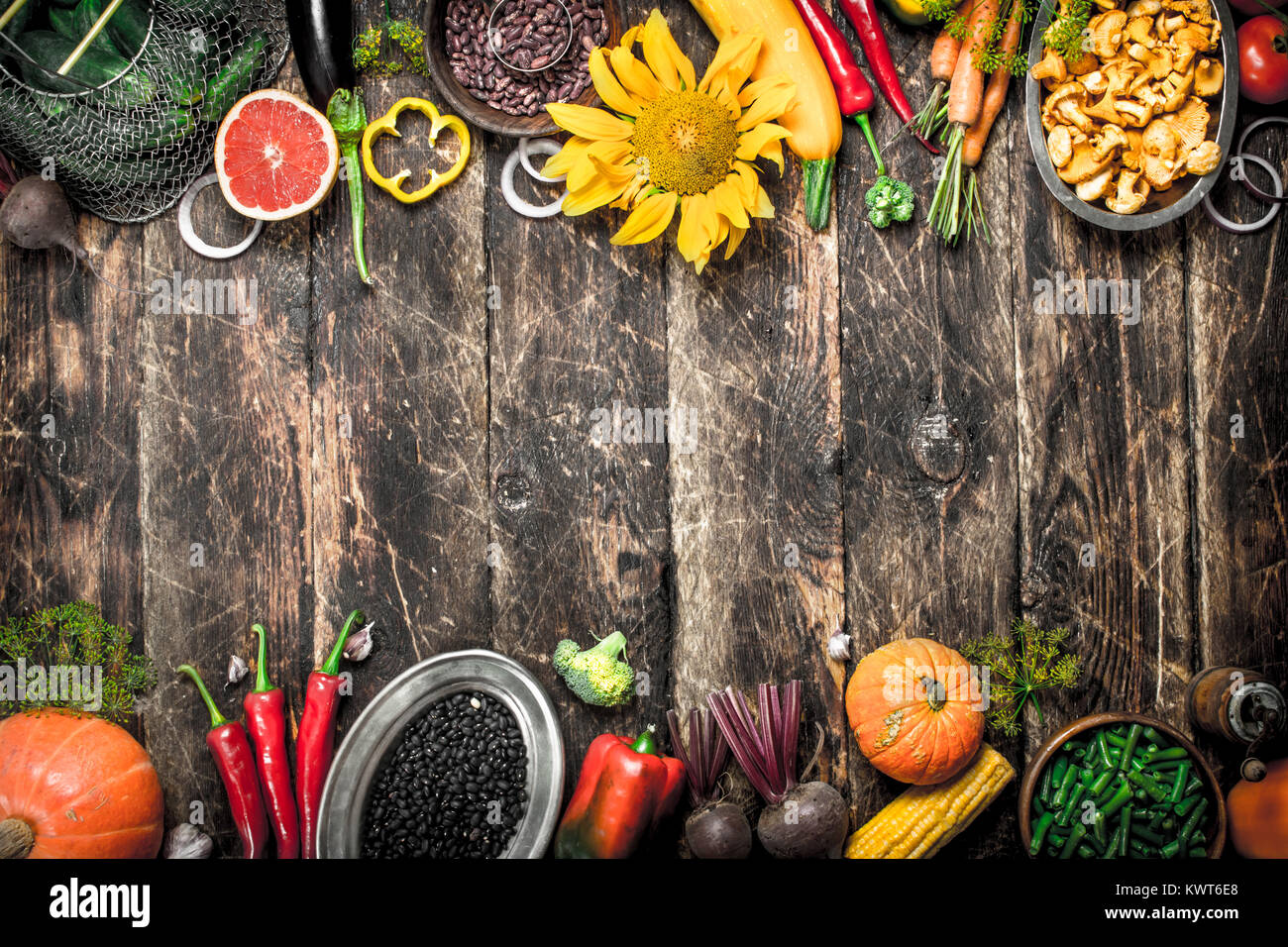 Organic food. Fresh vegetables and fruits. On a wooden background Stock ...