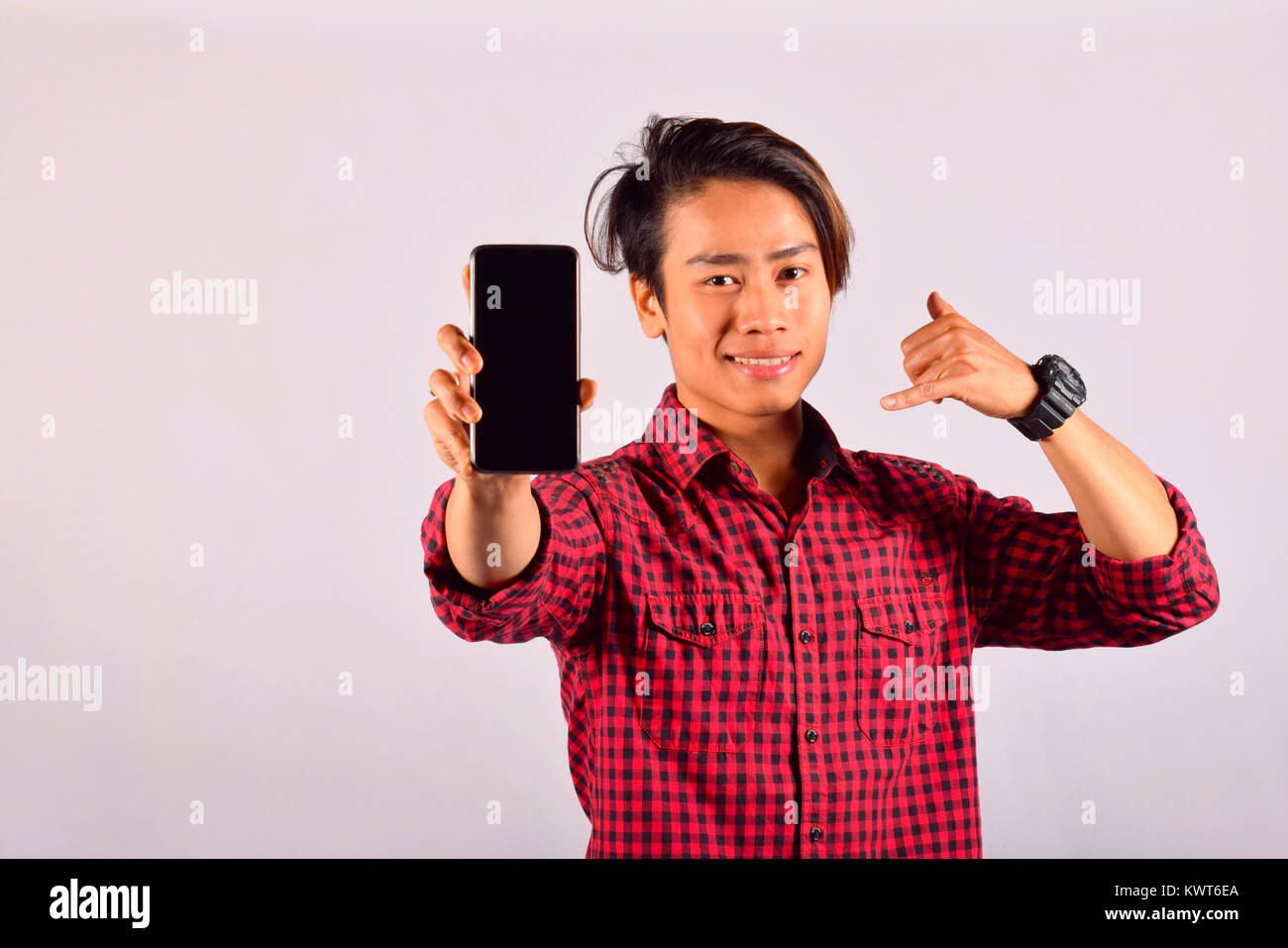 Young male model with mobile phone, Pune, Maharashtra Stock Photo - Alamy