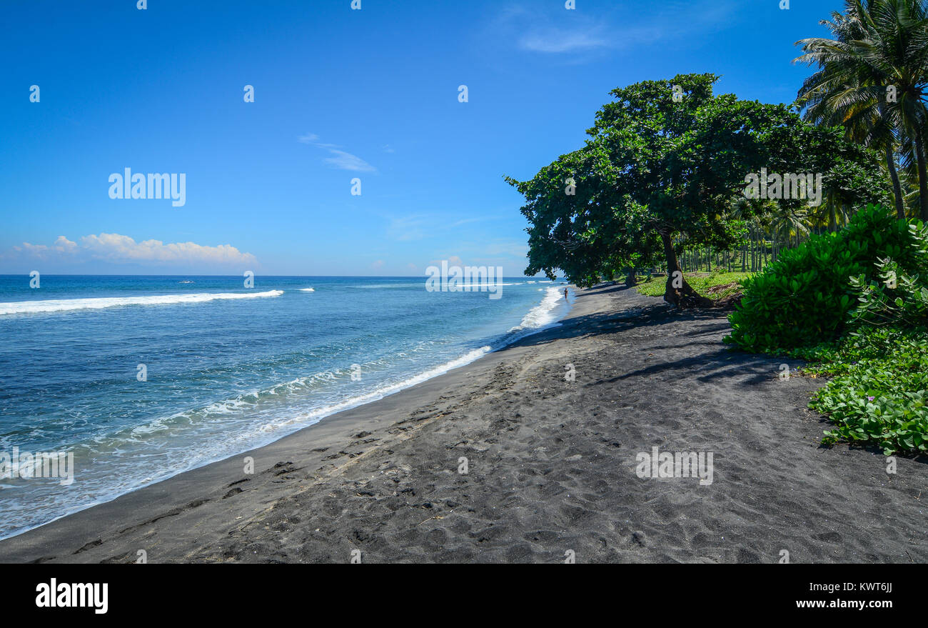 Black sand beach on Lombok Island, Indonesia. Lombok is an island in ...
