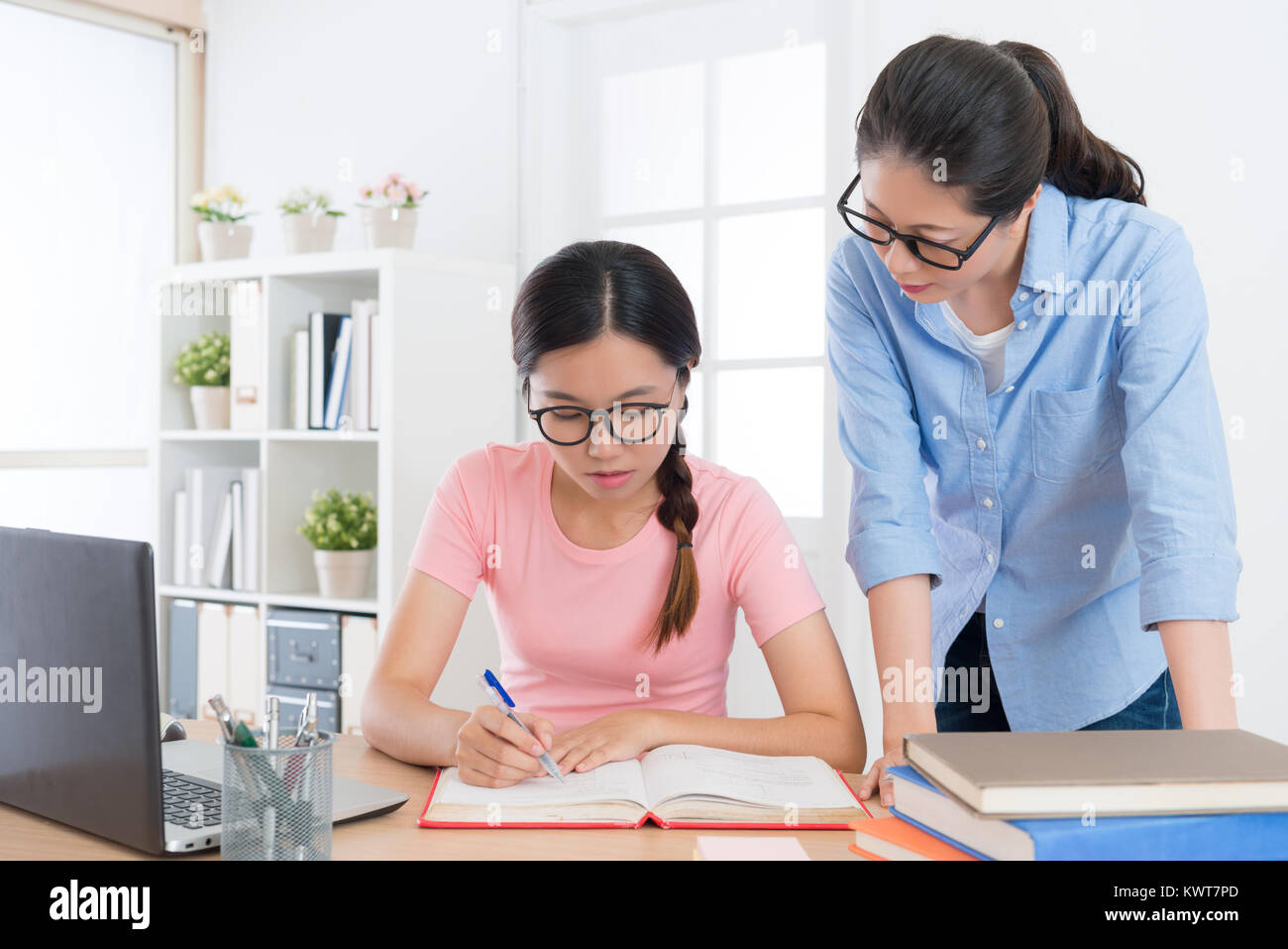 college student doing school homework having problem and asking her ...