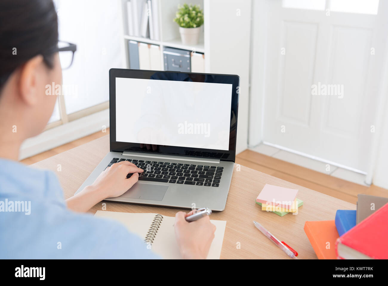 female college student using online e-learning system studying at home ...