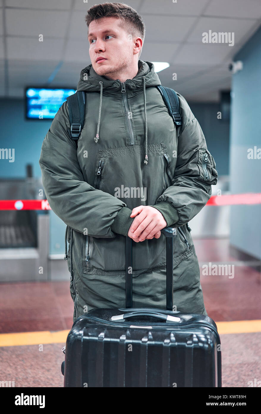 man with the suitcase at the airport Stock Photo - Alamy