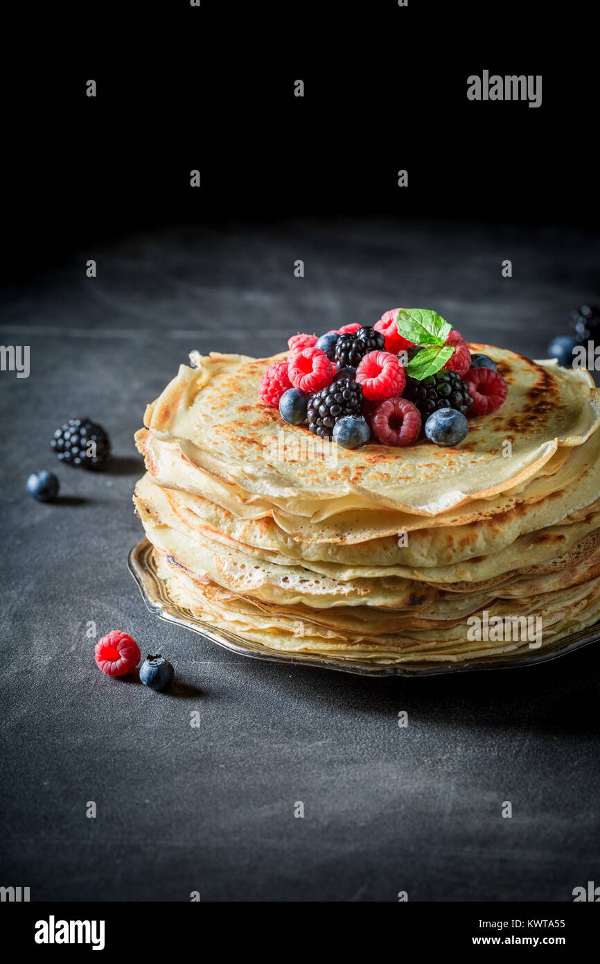 Big pancakes cake with fresh berries and mint Stock Photo - Alamy