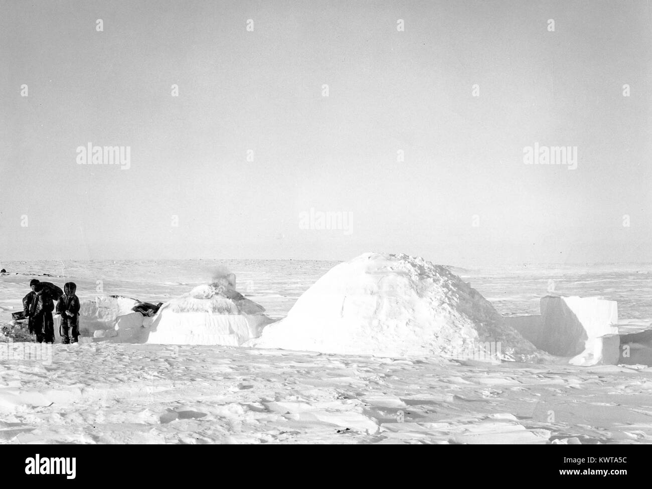Eskimo children near their igloos Stock Photo - Alamy