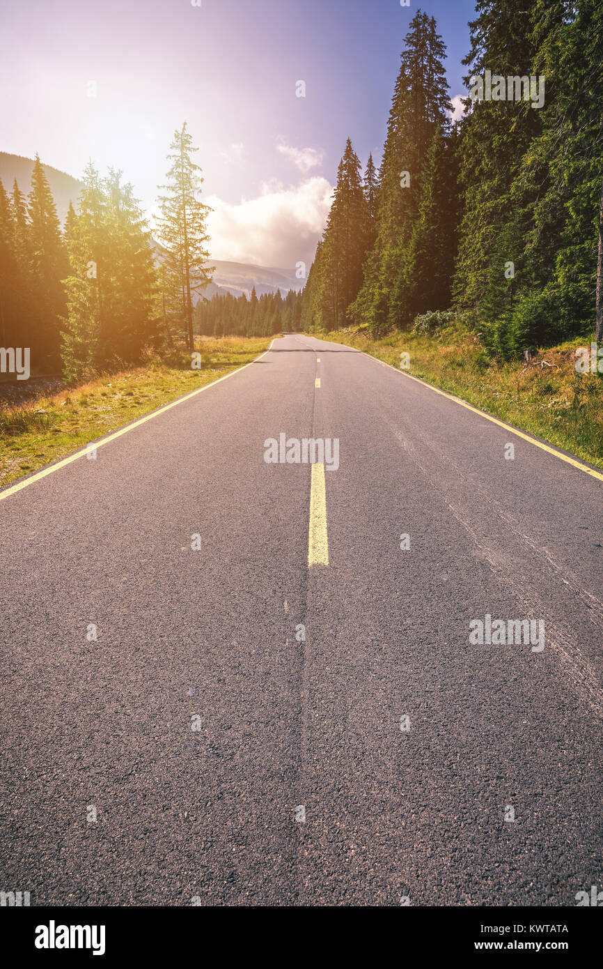 Mountain road. Landscape with rocks, sunny sky with clouds and ...