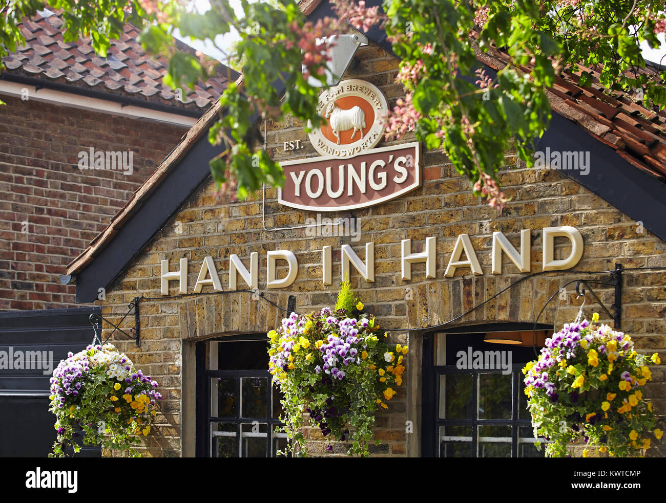 Hand in Hand pub signage in Wimbledon, London Stock Photo - Alamy