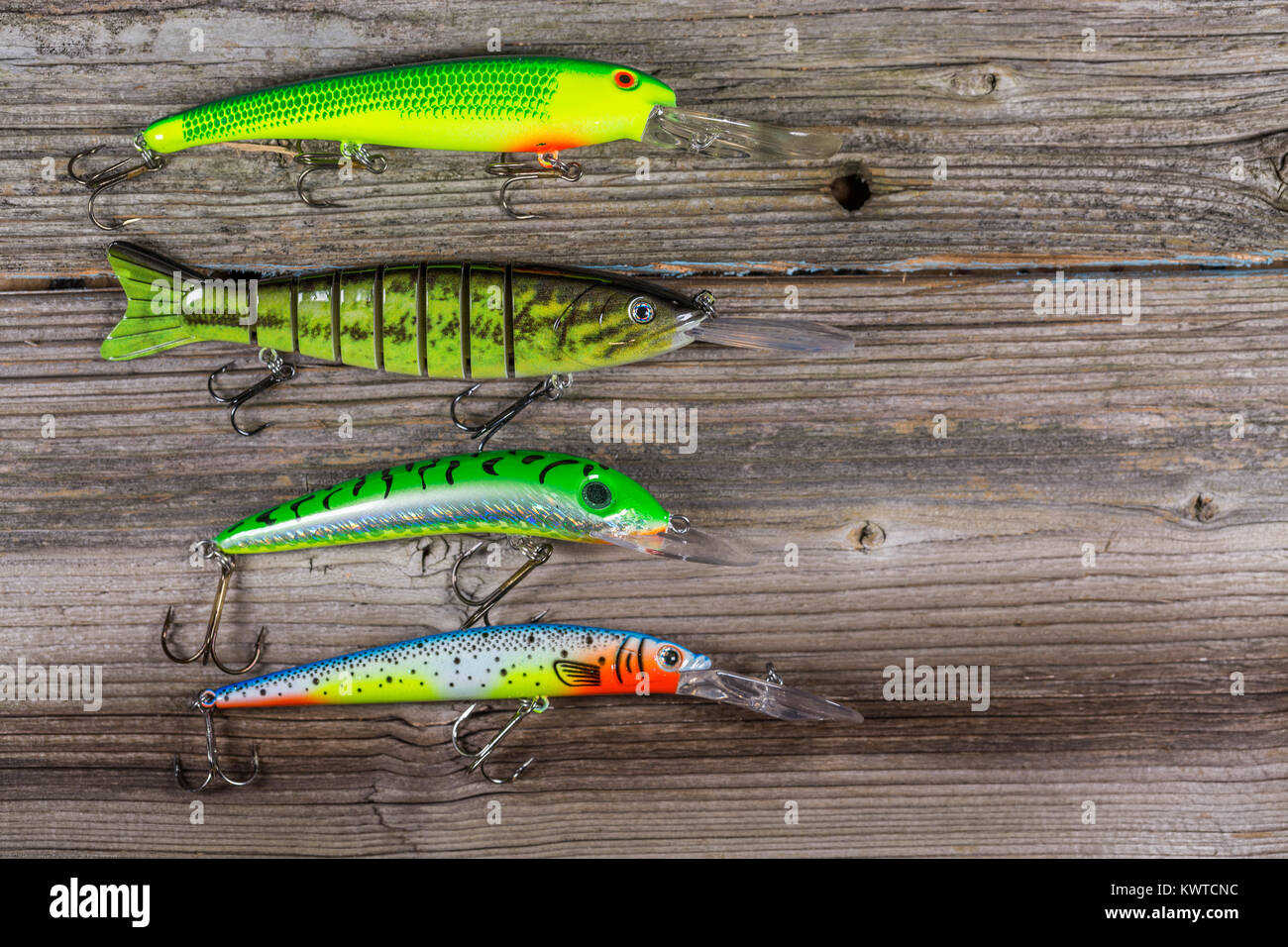 Fishing spinning and lures on wooden table Stock Photo - Alamy
