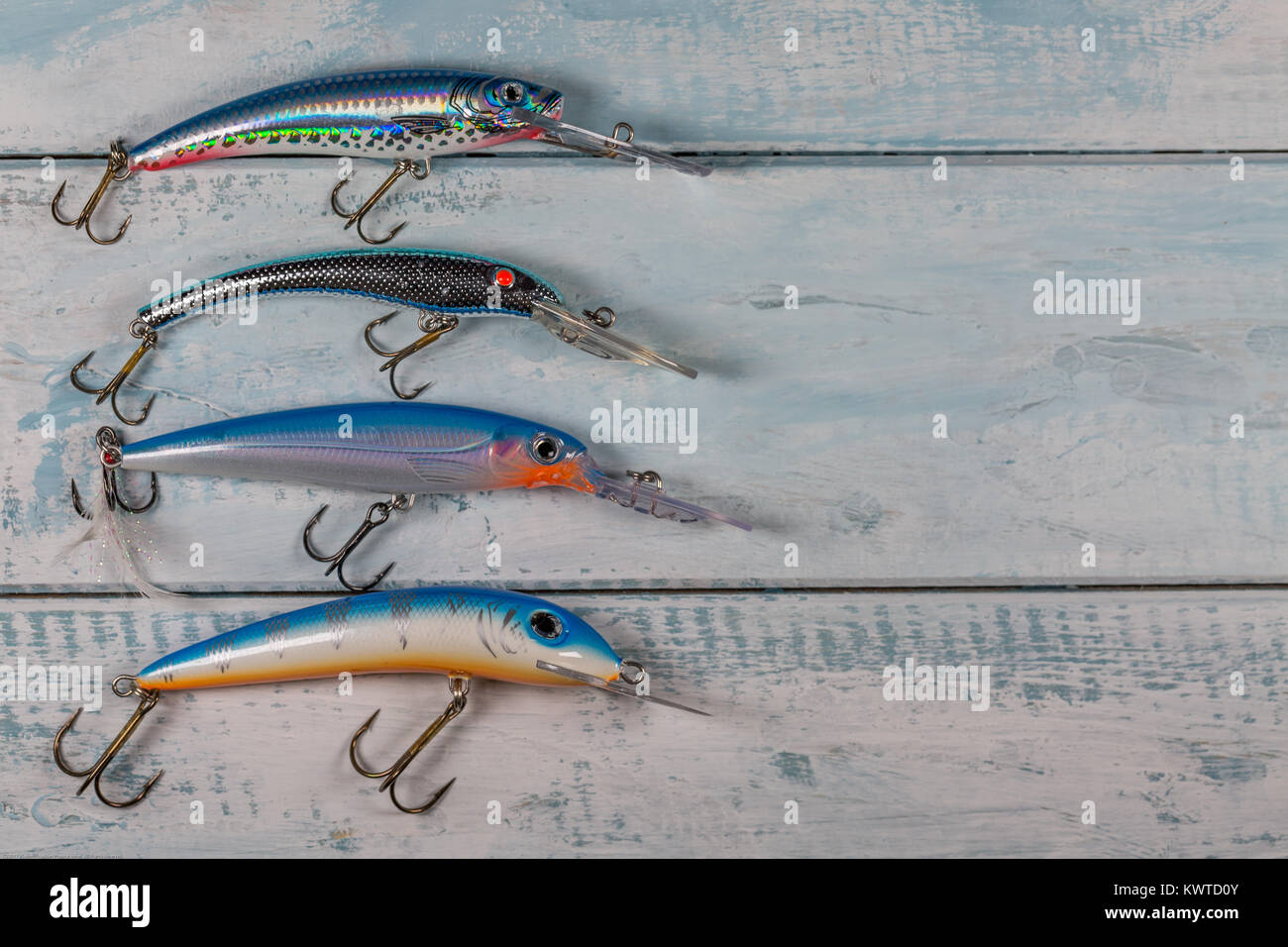 Colorful lures on the wooden background Stock Photo - Alamy