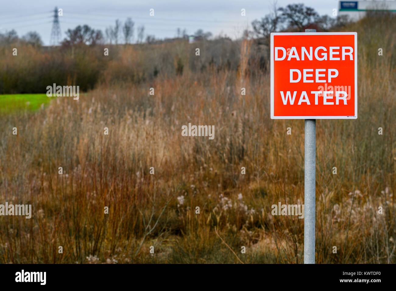 Red sign warning about deep water Stock Photo - Alamy