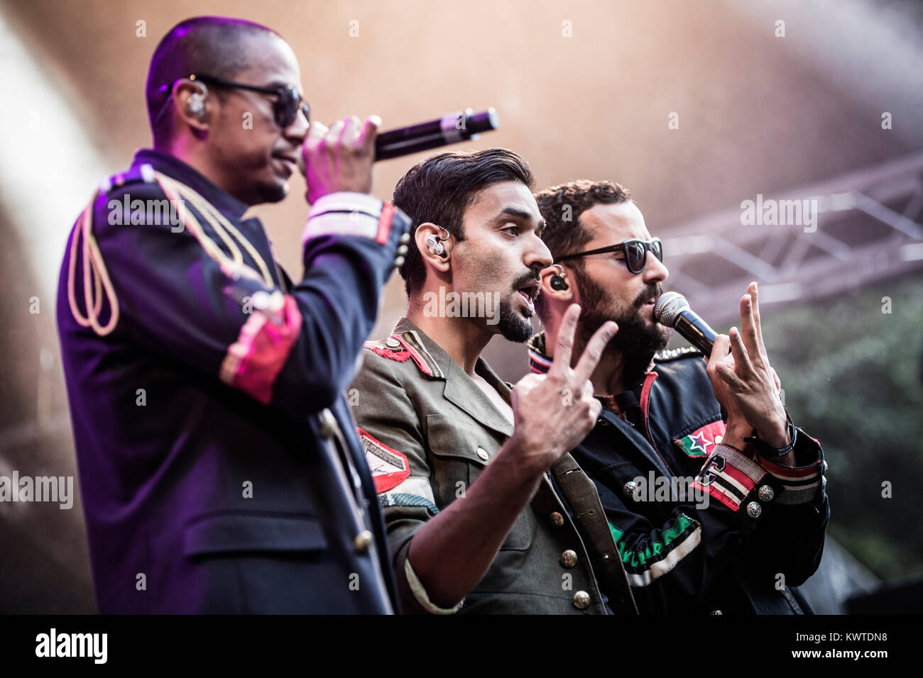 The three group members and rappers of the Danish group Outlandish are ...