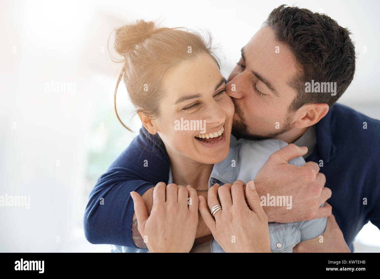 Cheerful romantic couple of lovers cuddling Stock Photo - Alamy