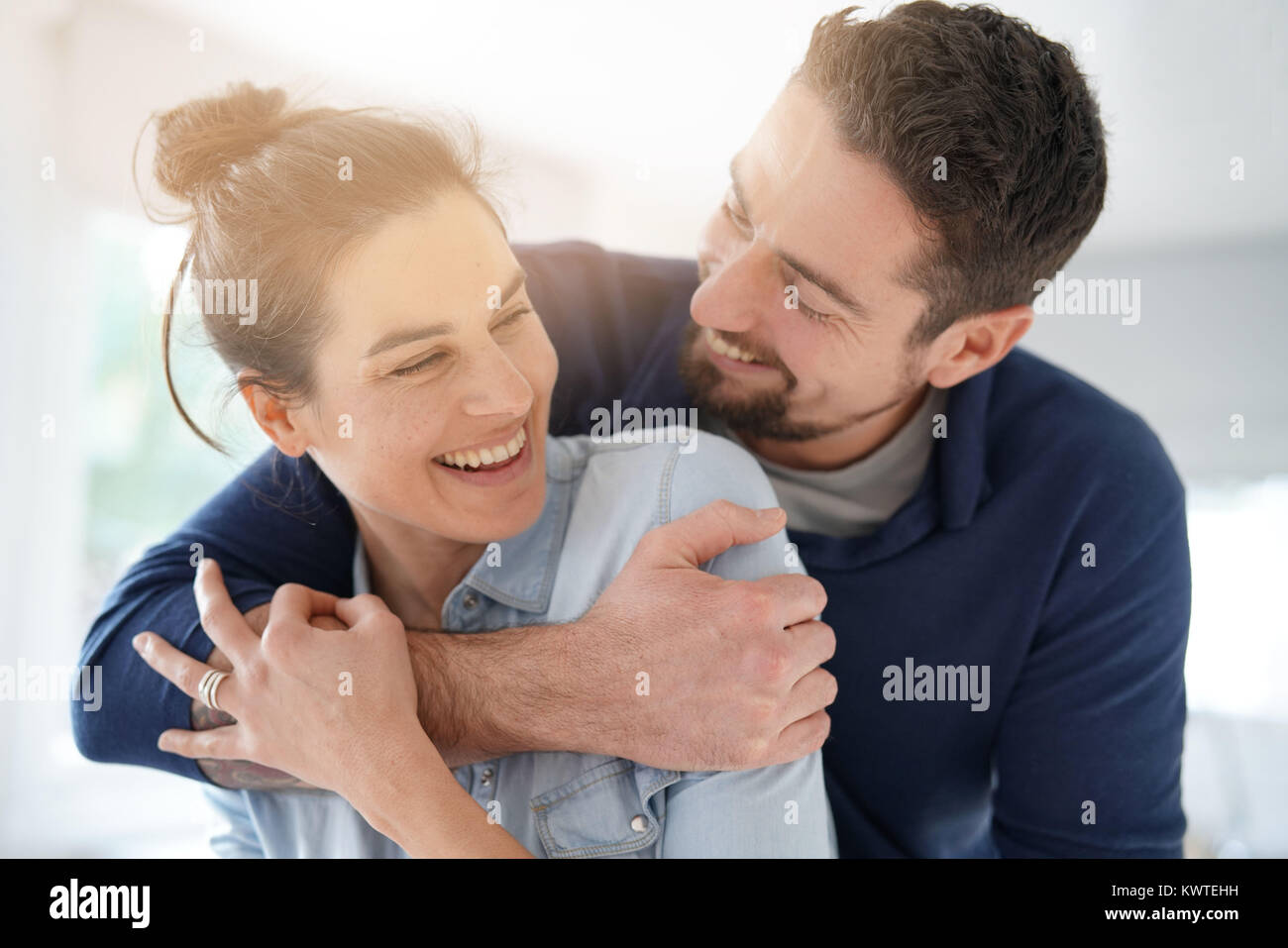 Cheerful romantic couple of lovers cuddling Stock Photo - Alamy