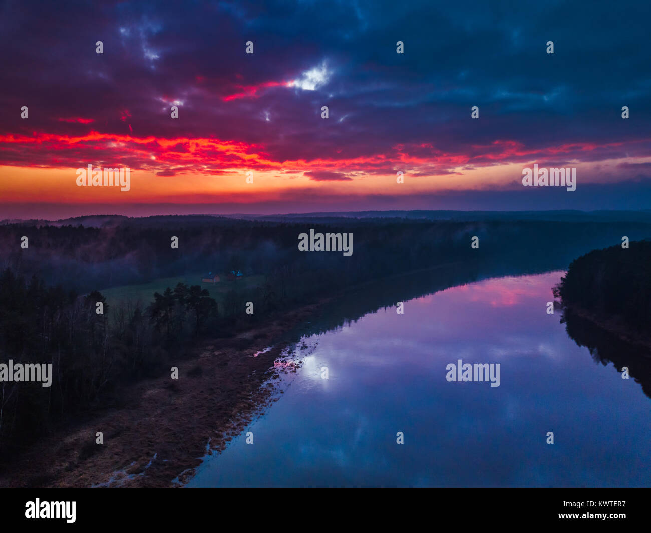 Aerial sunrise or sunset with colorful sky and reflections in the river ...
