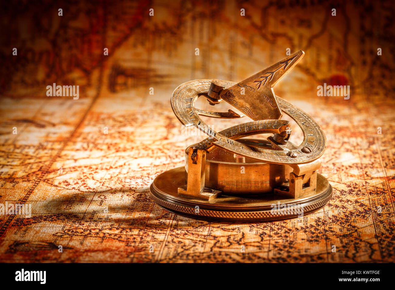 Vintage still life. Vintage compass lies on an ancient world map in ...