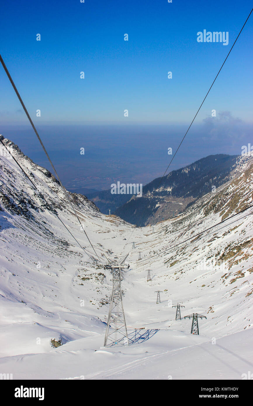 Car cable lines passing over the famous Transfagarasan road, covered in ...