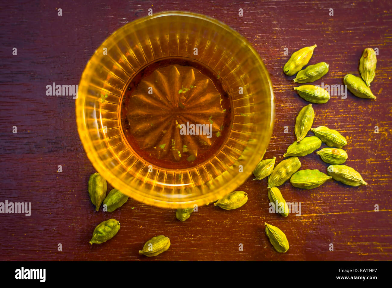 Water of green cardamom,Elettaria cardamomum on wooden surface Stock ...