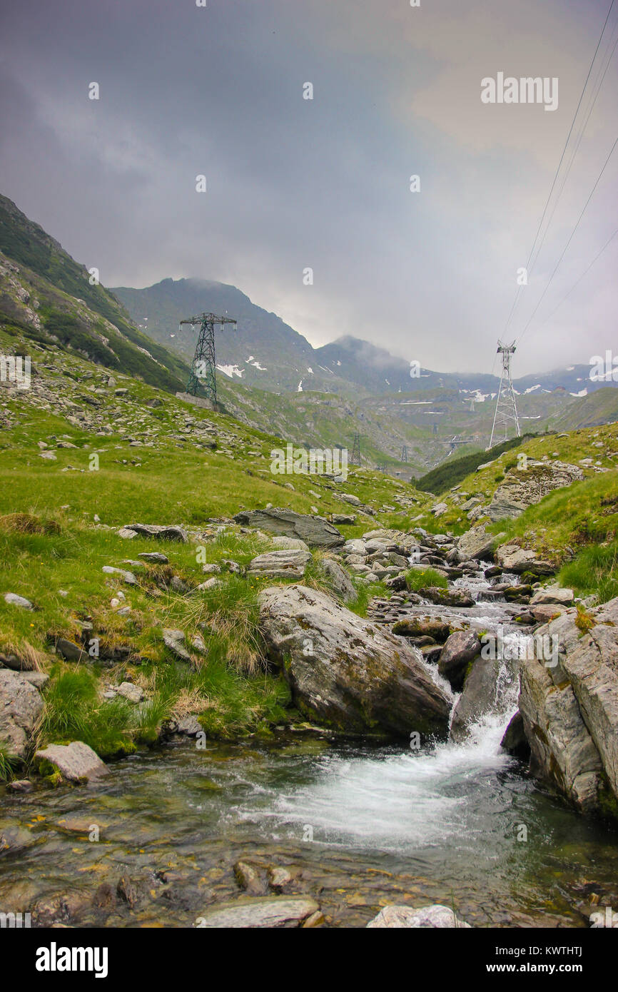 Alpine landscape with the Capra river and Fagaras Mountains alongside ...