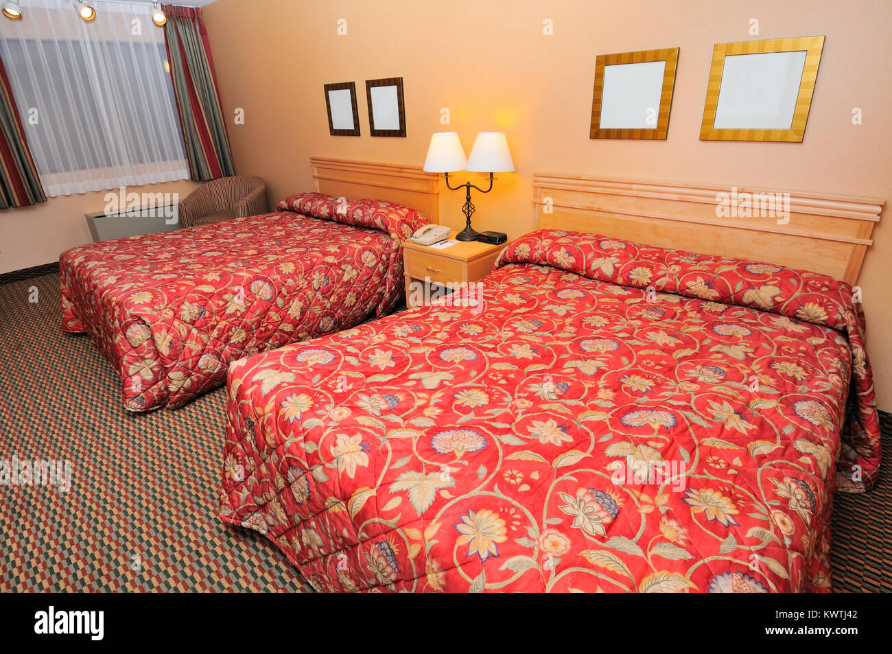 Large hotel room with twin large beds and romantic lighting Stock Photo ...