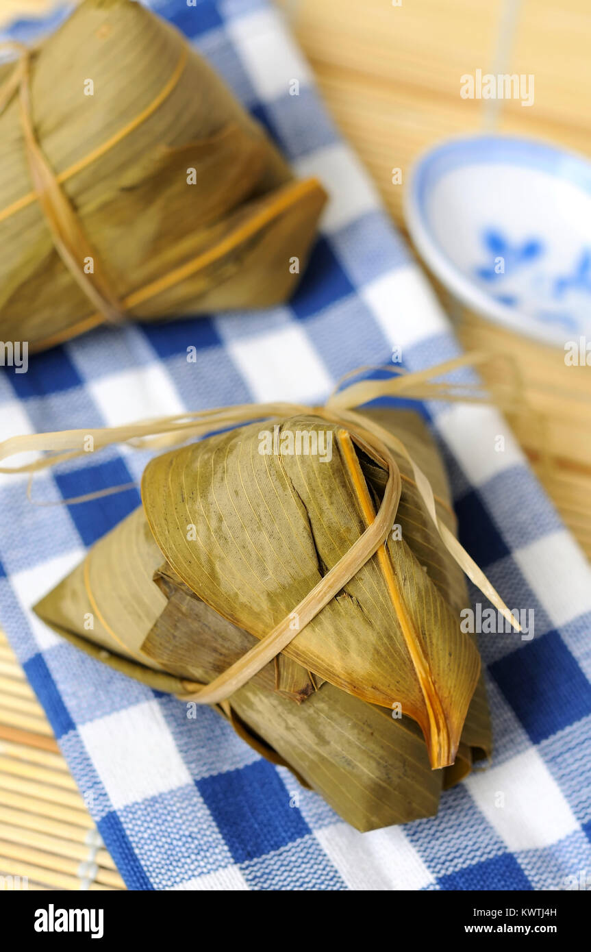 Rice dumpling wrapped in bamboo leaves hi-res stock photography and ...