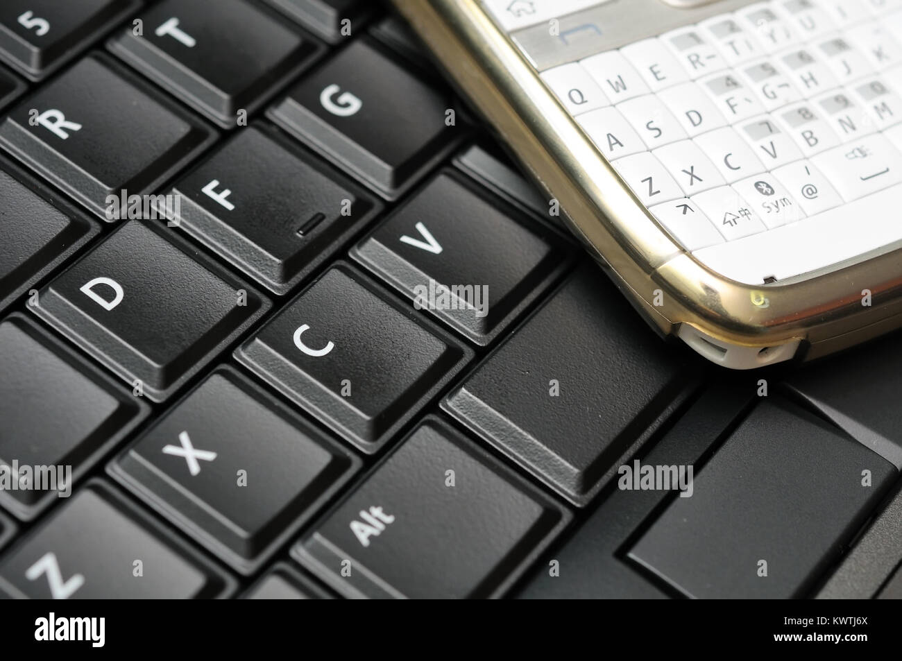 Business black computer keyboard and mobile phone Stock Photo - Alamy