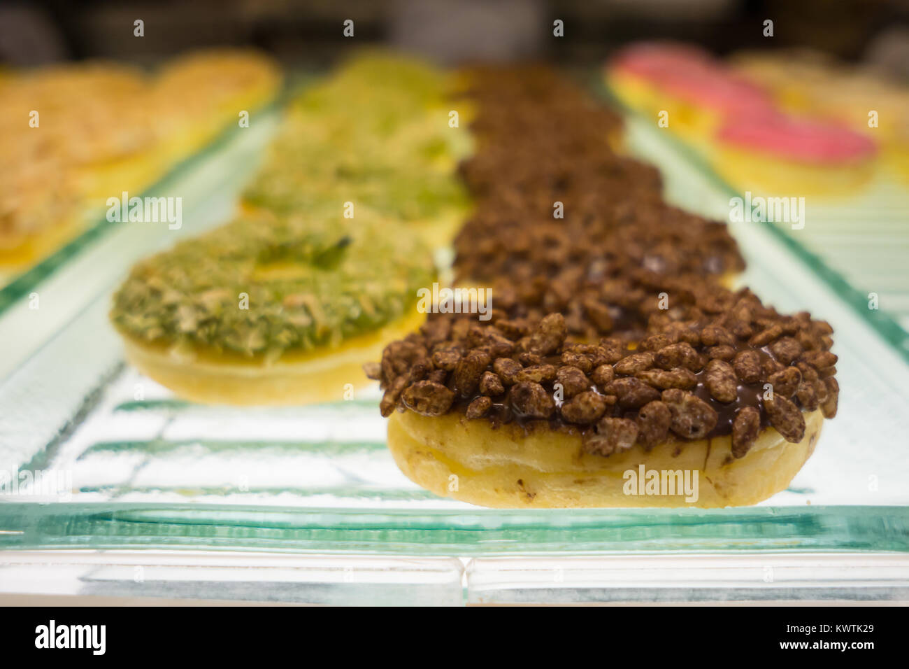 Donuts with the specific name of 'Mr Green Tea' (left) & 'Crunchy ...
