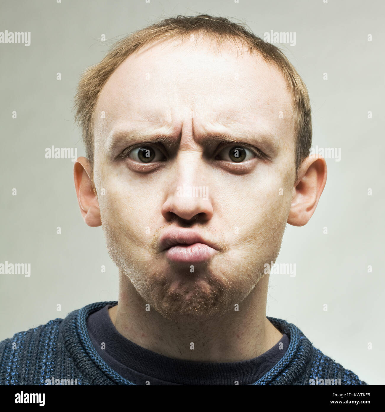 Perplexed real man Stock Photo - Alamy