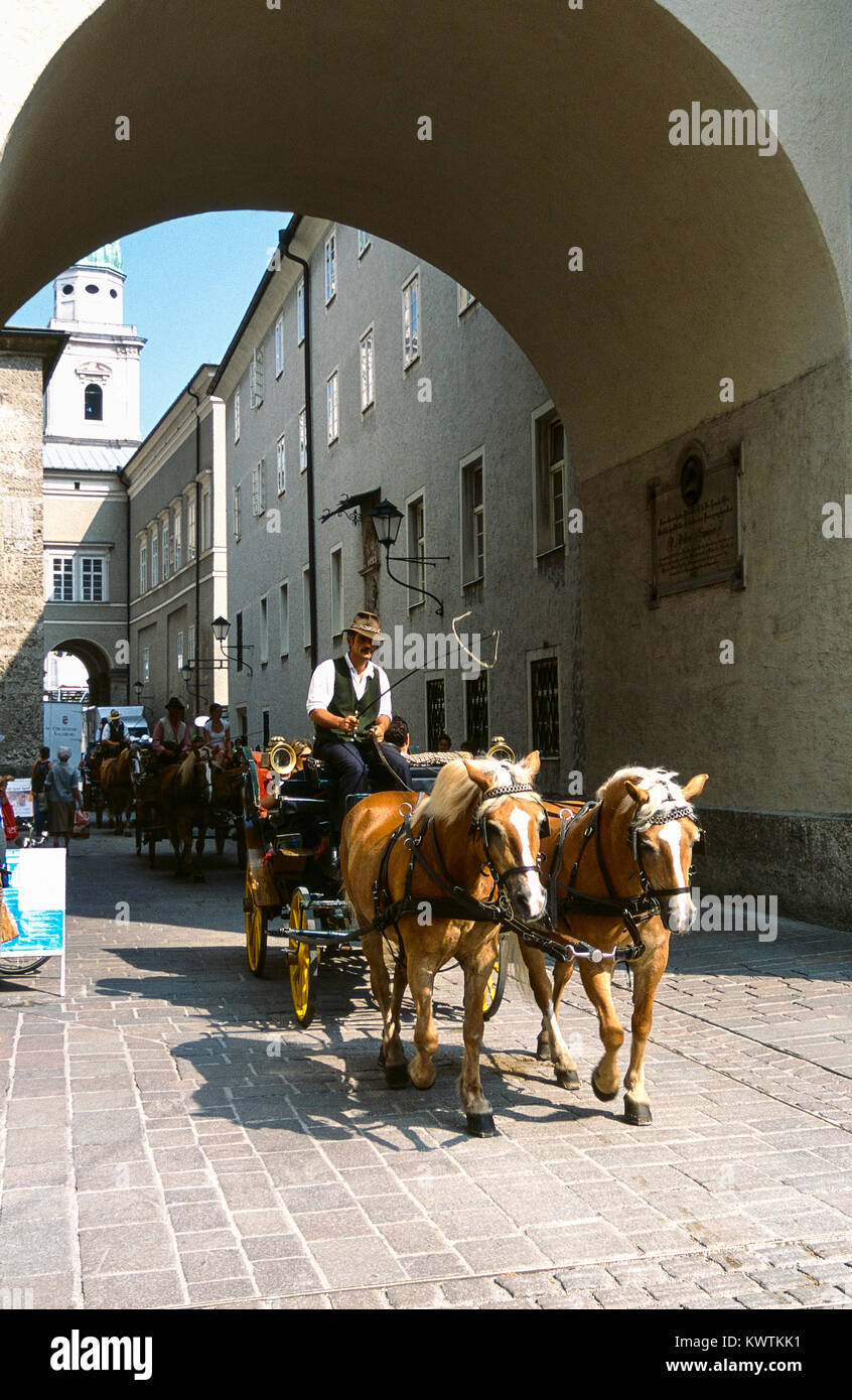 Fiaker Carriage Entering Residenzplatz Square from Beneath an Arch in ...