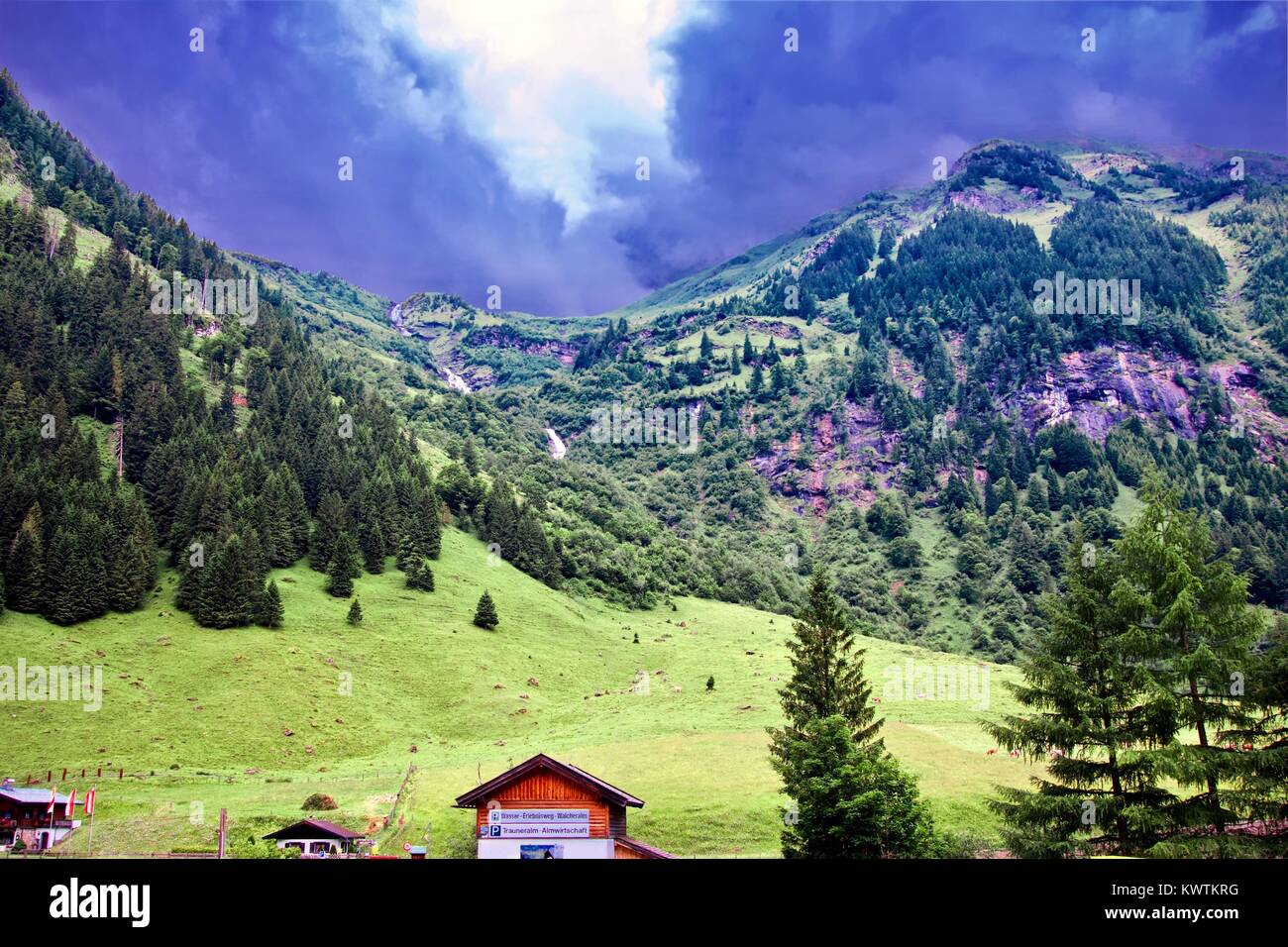 distant hills after a storm under a dark blue brooding sky with a wood ...