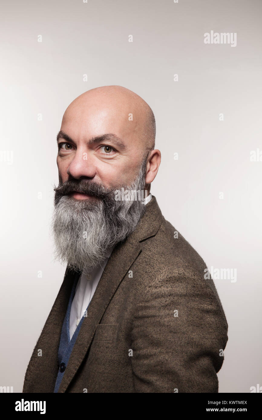 middle-aged man with beard, studio portrait Stock Photo - Alamy