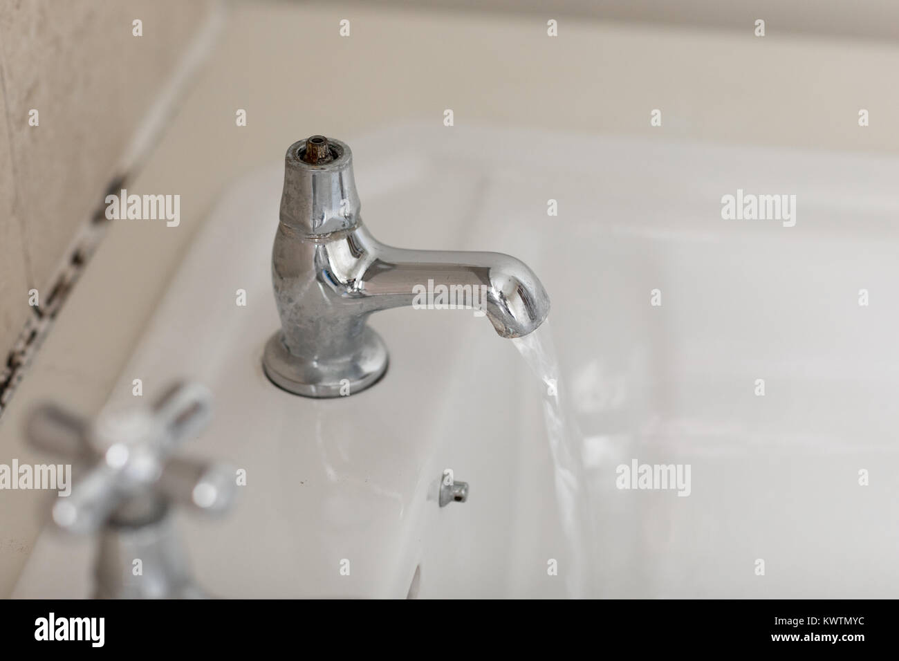 A broken bathroom tap Stock Photo - Alamy