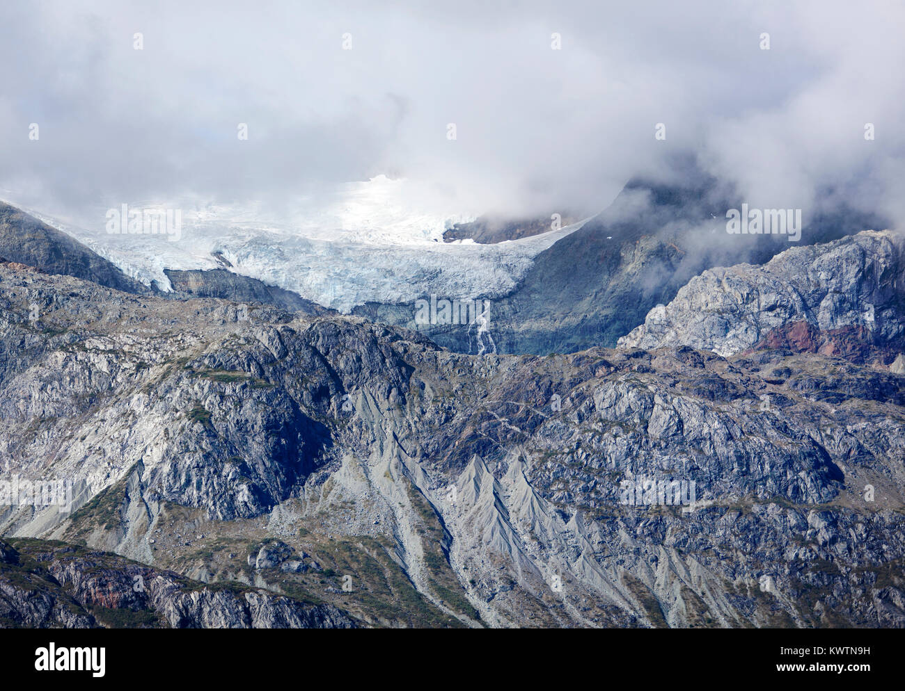 The aerial view of a little glacier high in mountains in Glacier Bay ...