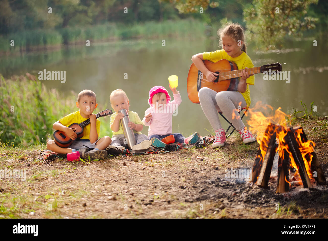 photo of happy children hiking in the forest Stock Photo - Alamy