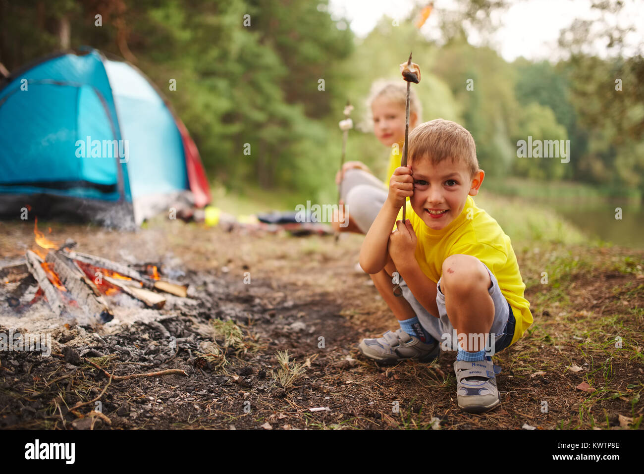 photo of happy children hiking in the forest Stock Photo - Alamy