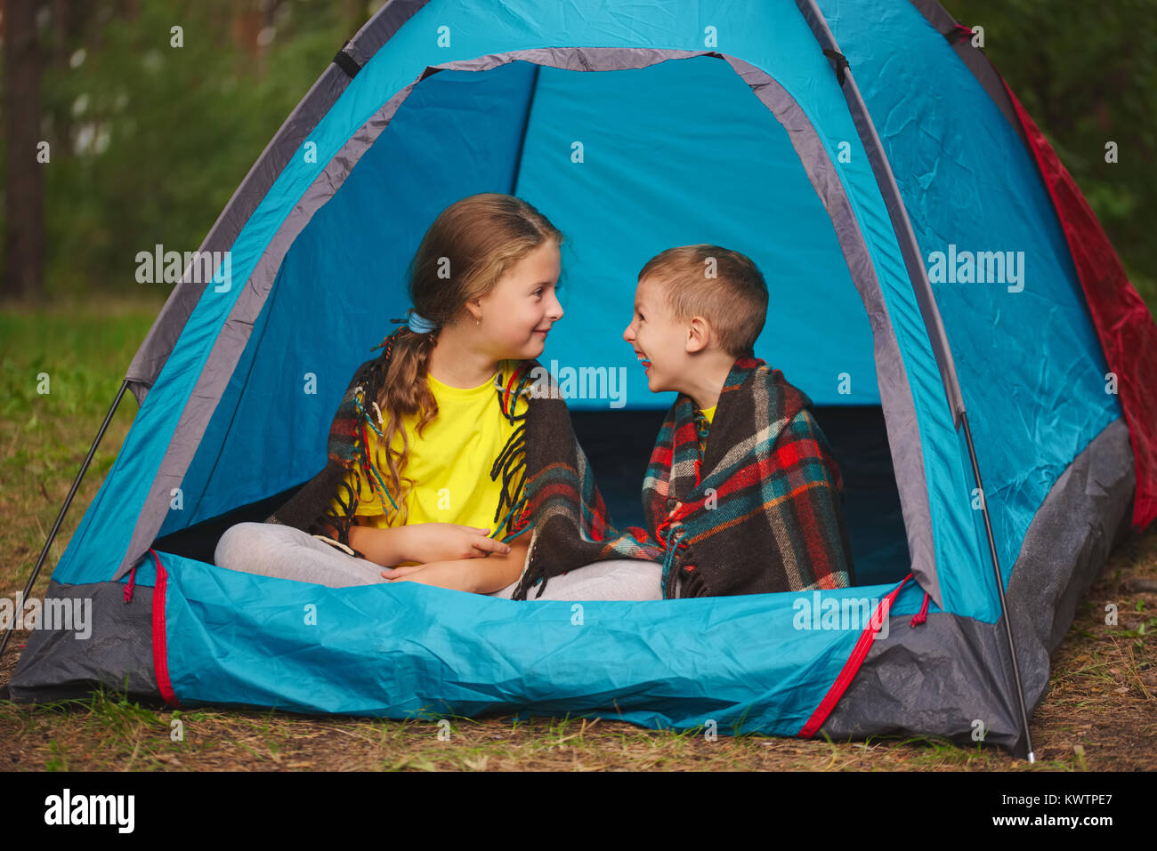 photo of happy children hiking in the forest Stock Photo - Alamy