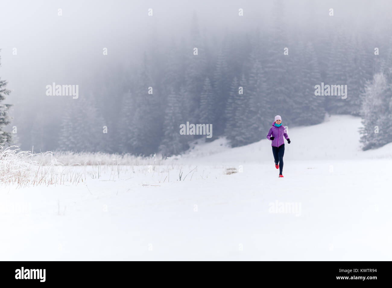 Trail running woman in winter mountains. Sport, fitness inspiration and ...