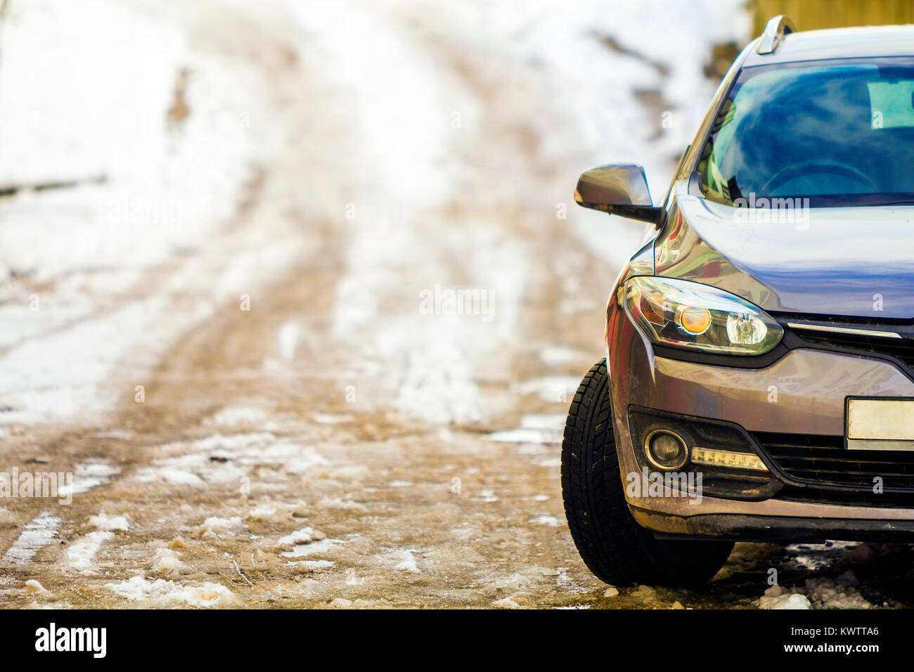 New modern grey car parked on a street in winter Stock Photo - Alamy