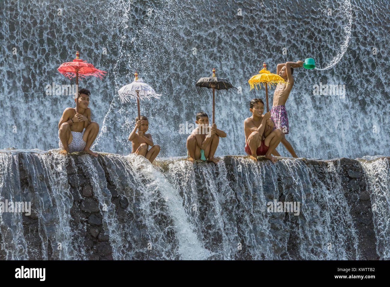 Boys hamming it up for the camera at Tukad Unda dam, Bali Island ...