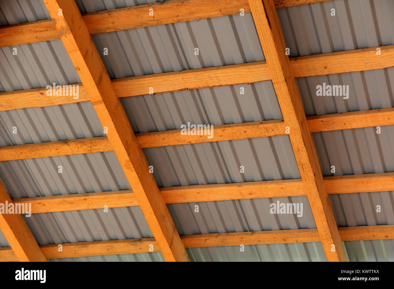 Wooden frame of new roof from inside. Construction framework Stock ...