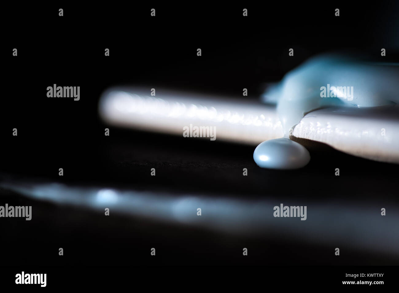 Melted wax dripping and forming a shape Stock Photo - Alamy