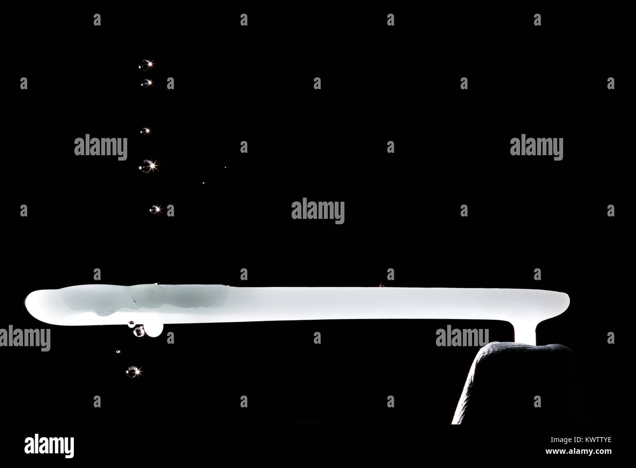 Dripping wax on horizontal bar shaped figure Stock Photo - Alamy