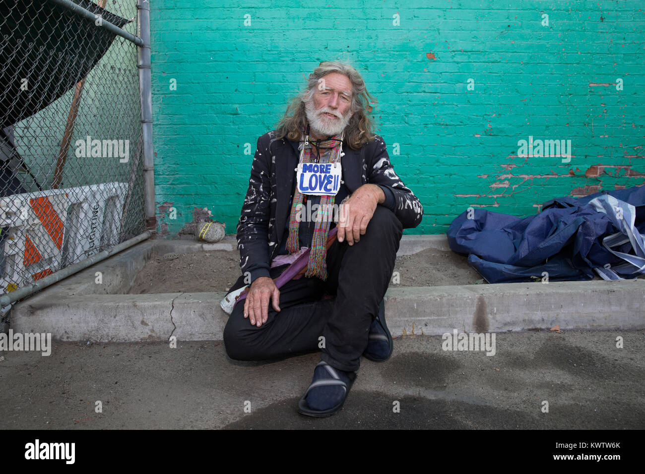 David Busch, homeless man in Los Angeles with "More Love" sign around ...