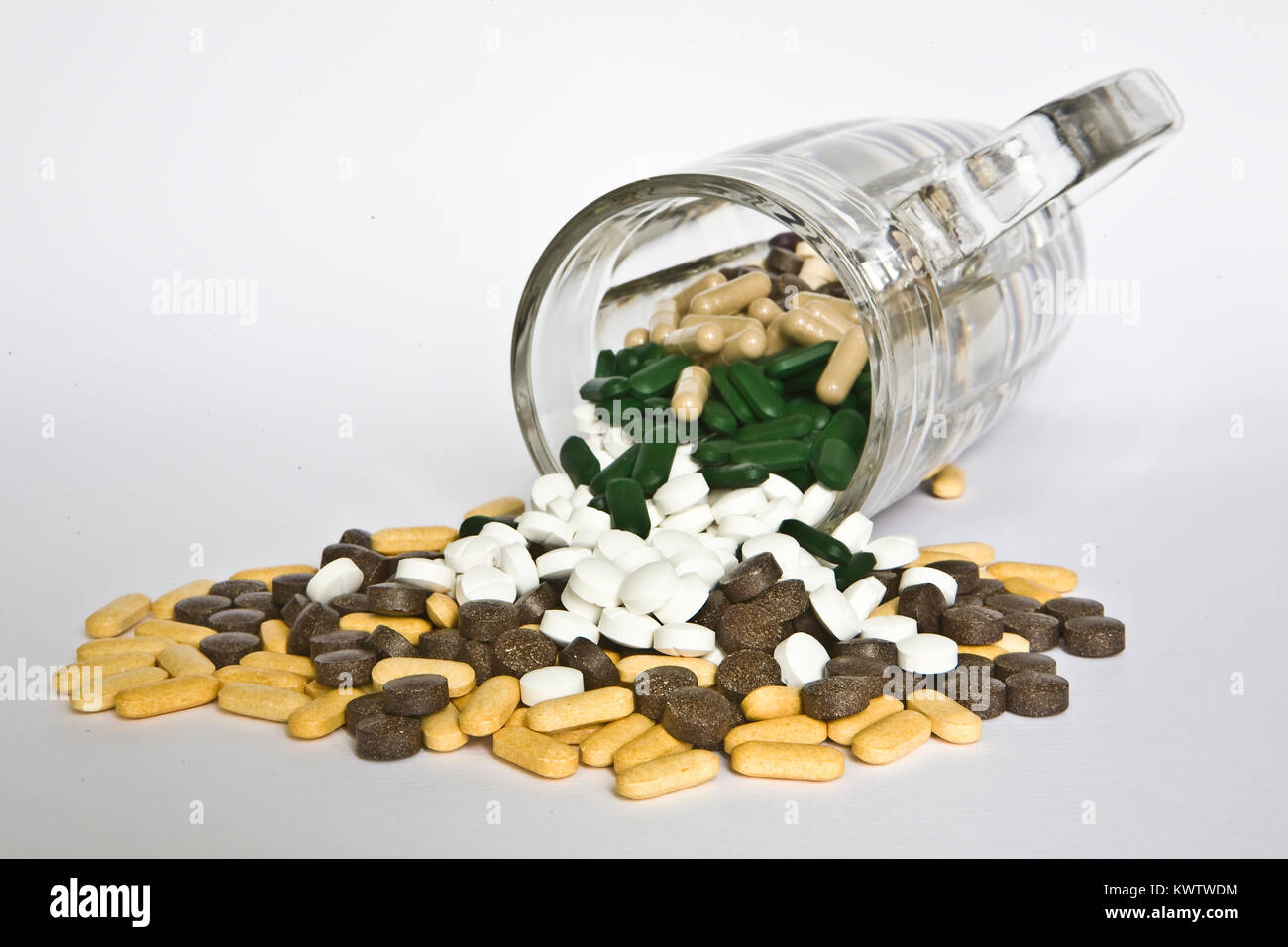beer mug of drugs pills Stock Photo - Alamy