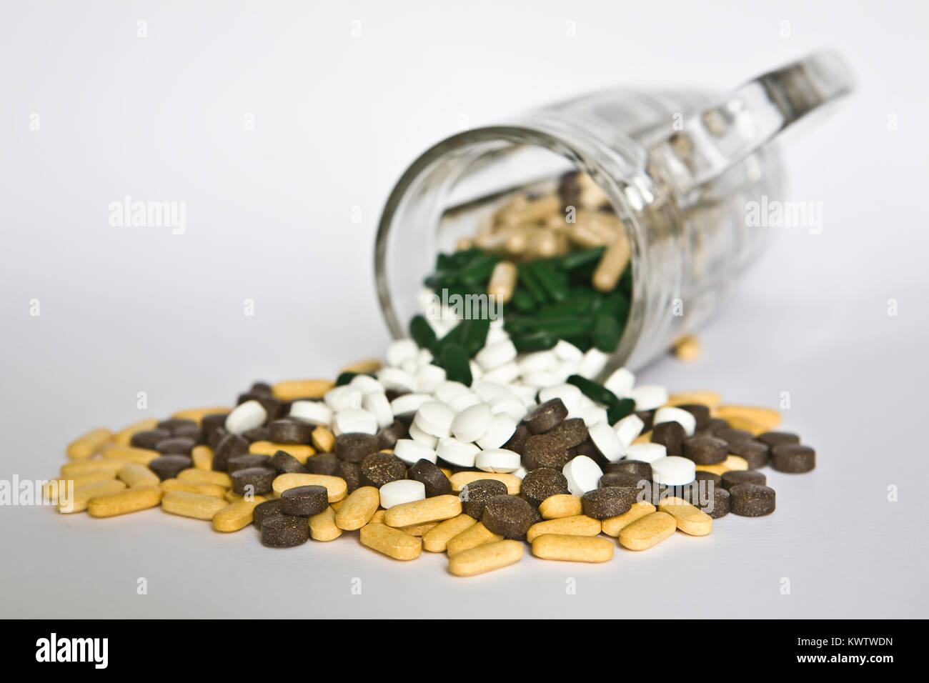 beer mug of drugs pills Stock Photo - Alamy