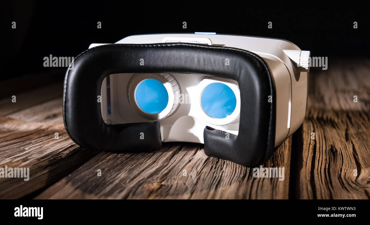 White vr glasses on old wooden boards Stock Photo - Alamy